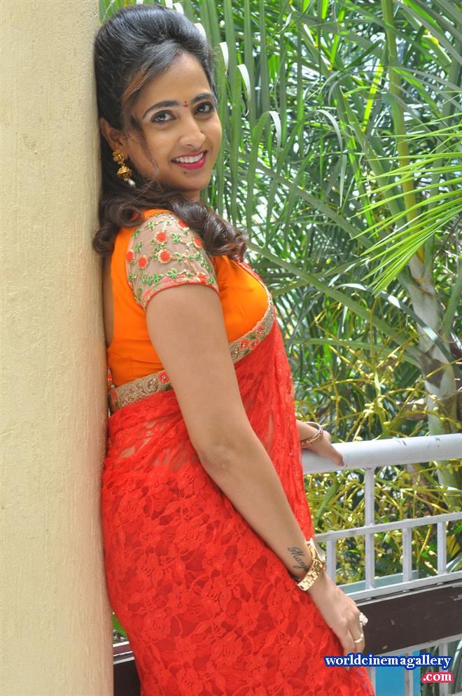 Anchor Lasya Latest Stills in Orange Saree
