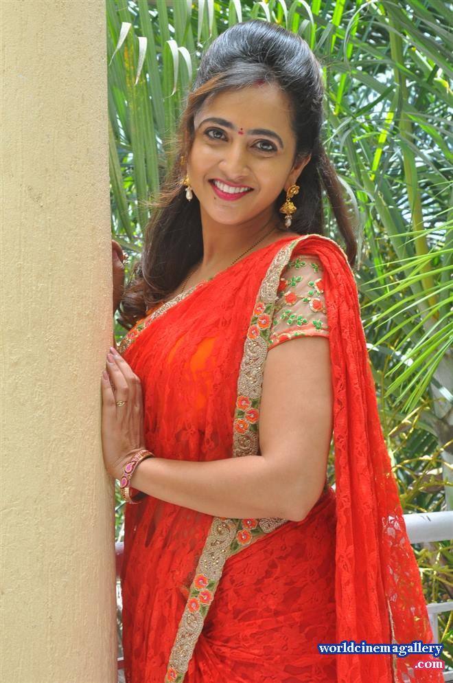 Anchor Lasya Latest Stills in Orange Saree