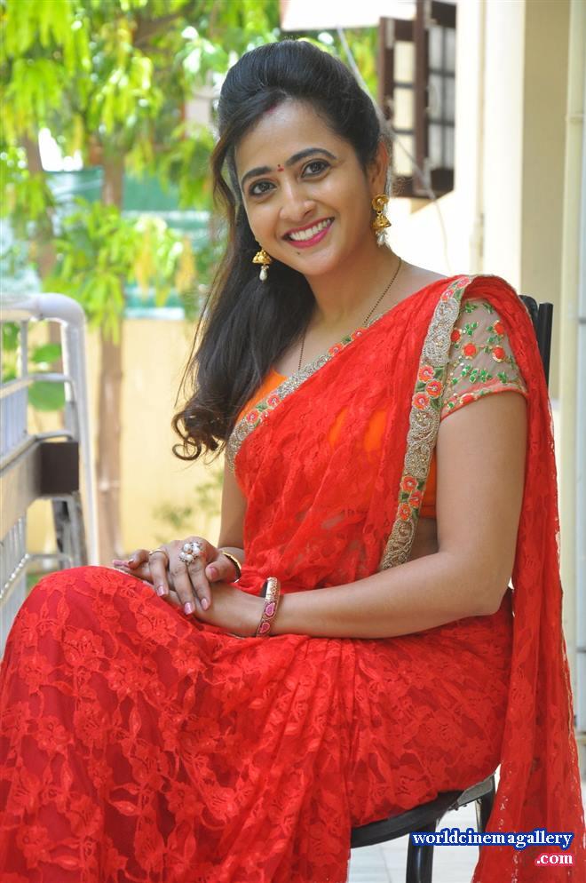 Anchor Lasya Latest Stills in Orange Saree