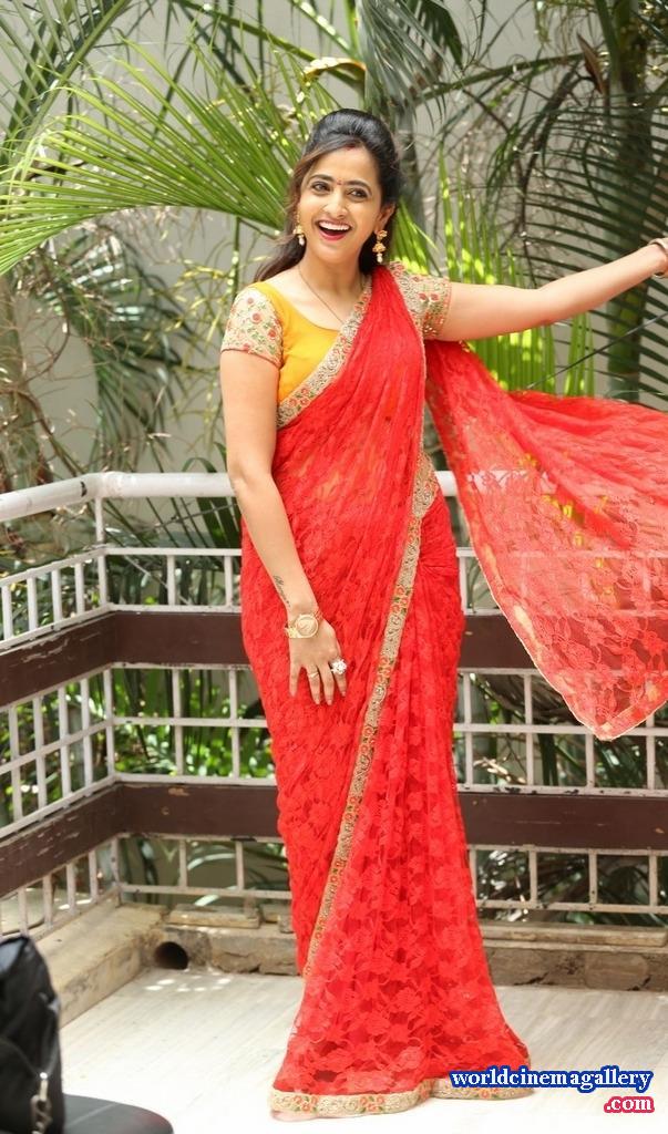 Anchor Lasya Latest Stills in Orange Saree