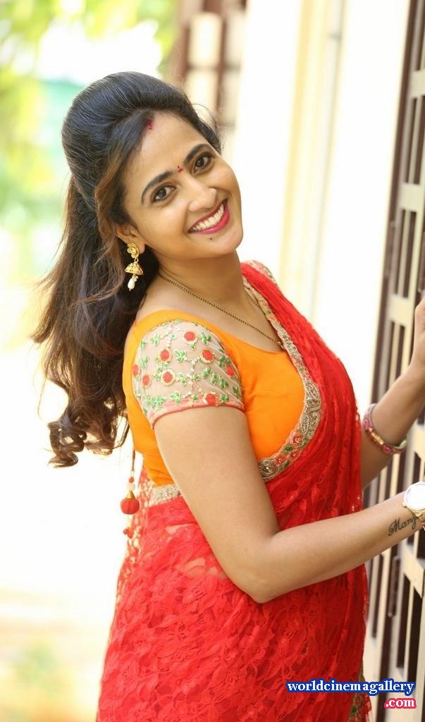 Anchor Lasya Latest Stills in Orange Saree