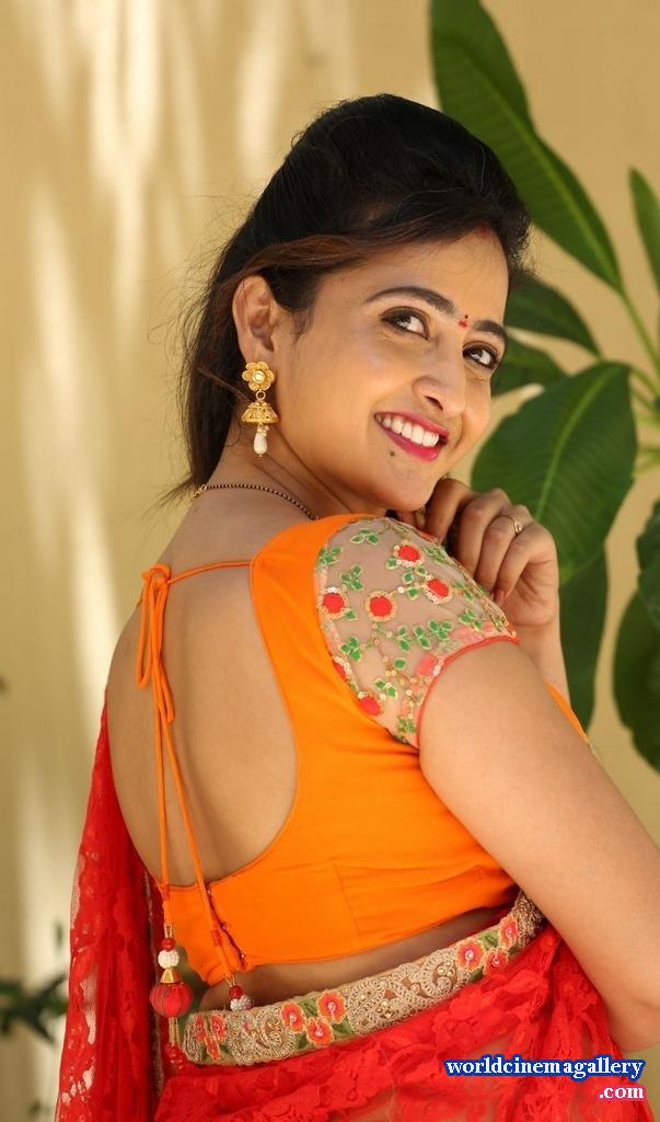 Anchor Lasya Latest Stills in Orange Saree